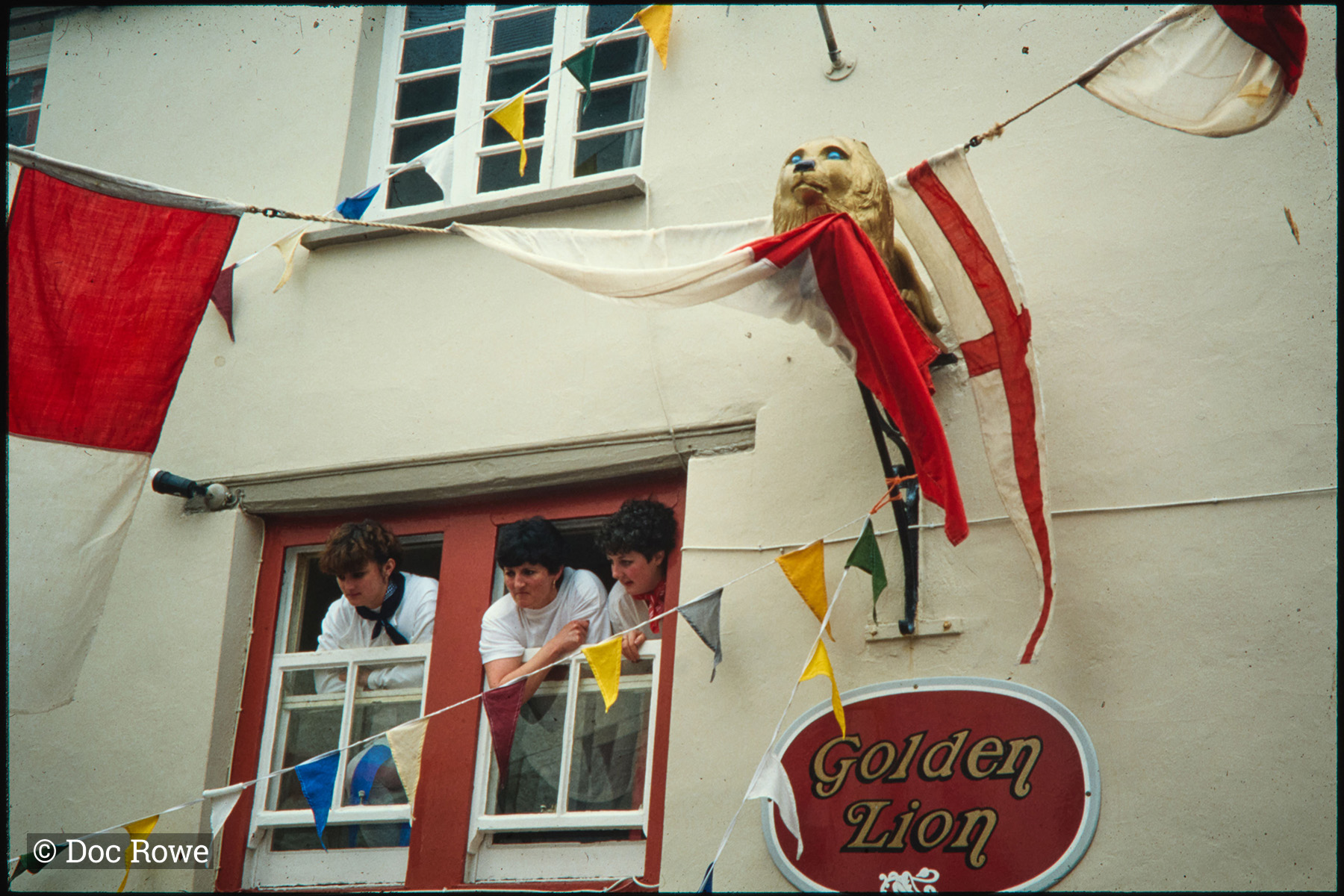 People watching from Golden Lion upstairs window | Echoes of Padstow